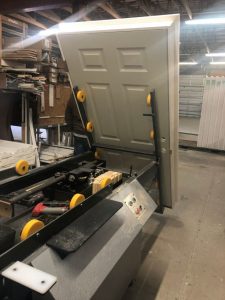 Door Shop Adds New Machine to Assemble 8-foot Doors - Harbin Lumber